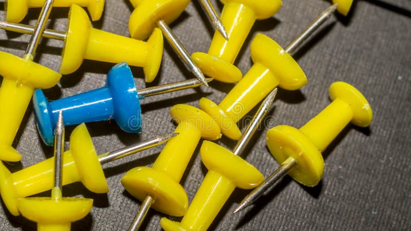 Blue Surrounded by Yellow Push Pins. Stock Photo - Image of colors ...