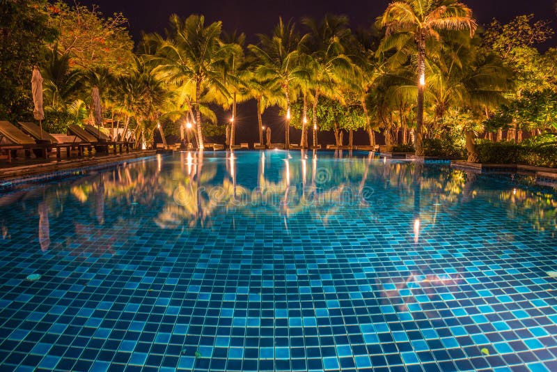 Blue Swimming Pool with Light Reflections at Night Stock Image - Image ...