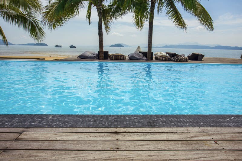 Blue Swimming Pool Summer Vacation and Wooden Deck Stock Photo - Image ...