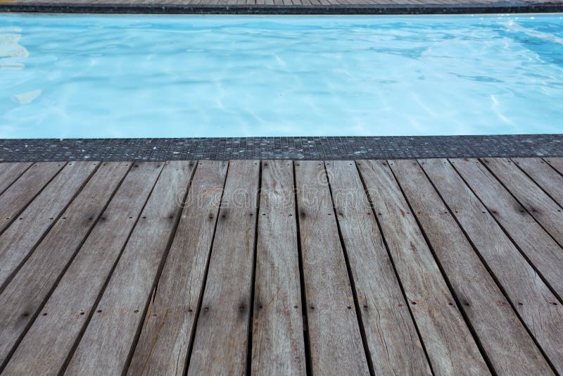 Blue Swimming Pool Summer Vacation and Wooden Deck Stock Image - Image ...