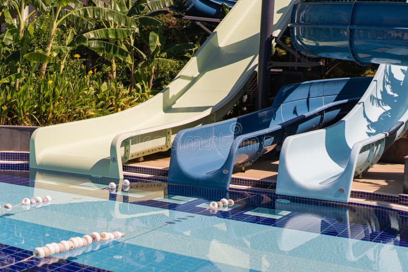 Blue Swimming Pool with Water Slide Stock Image - Image of swimming ...