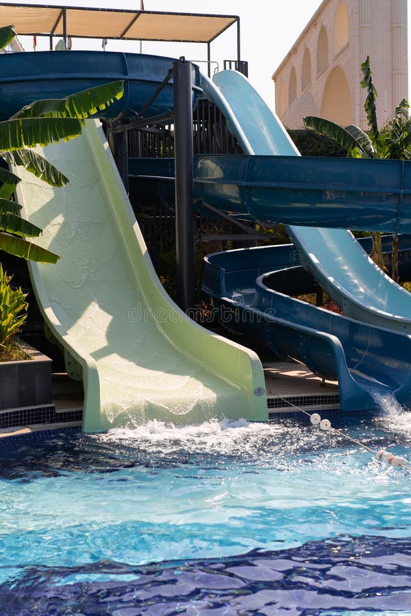 Blue Swimming Pool with Water Slide Stock Image - Image of pool, happy ...