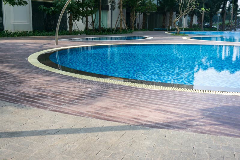 Blue Swimming Pool with Wood Flooring Stripes Stock Image - Image of ...