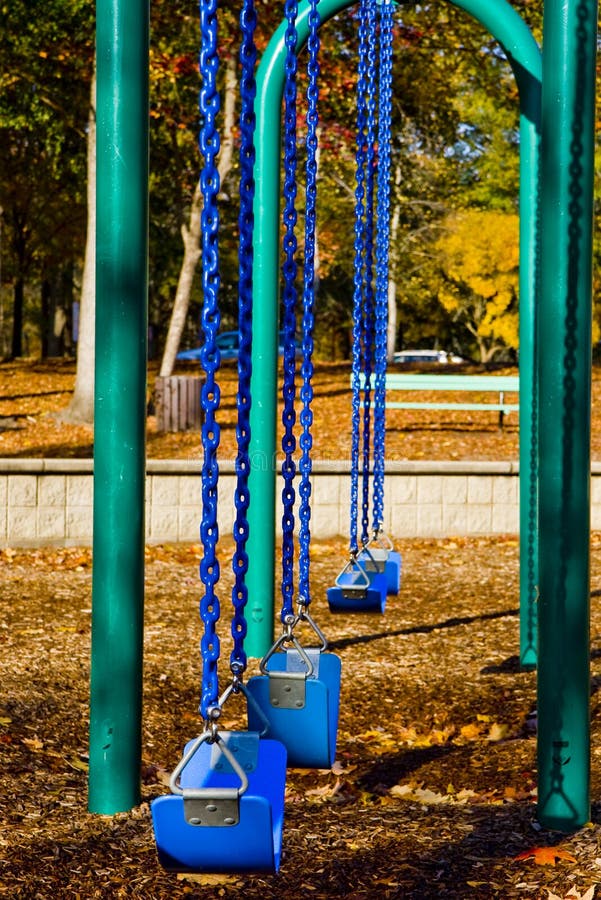 Two Blue Swings stock photo. Image of playgrounds, empty - 6492484