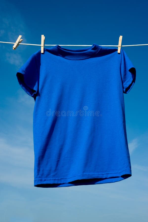 A Blue T-Shirt stock image. Image of clothes, pins, clothing - 5373709