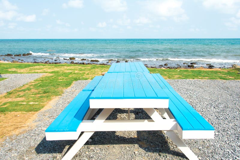 Blue table near the sea stock photo. Image of beach, ocean - 63817624