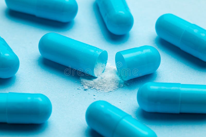 Blue Tablets in Capsules. One Capsule is Open Stock Photo - Image of ...