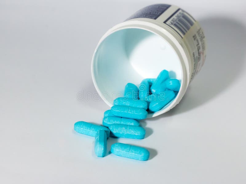 Blue Tablets Pills Spilling from White Container Stock Image - Image of ...