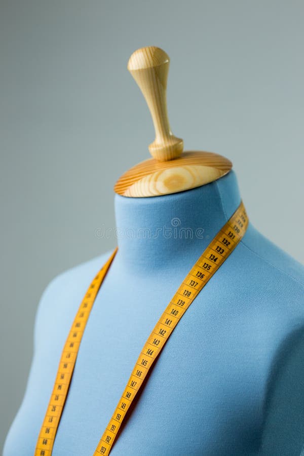 Blue Tailor Dummy with Measuring Tape Alongside the Wall. Stock Photo ...