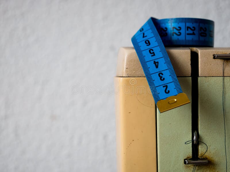 Blue Tailoring Meter on an Old Vintage Sewing Machine Stock Photo ...
