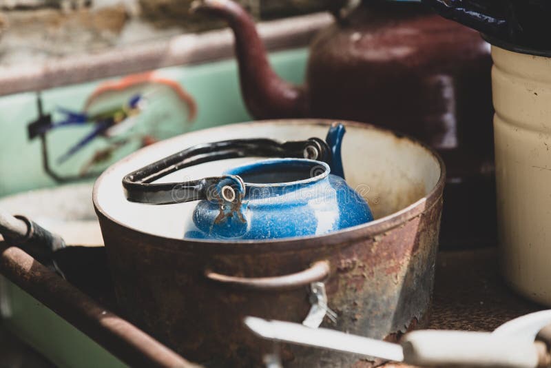 Blue Teapot in Rusty Stewpan Stock Photo - Image of rustic, teapot ...