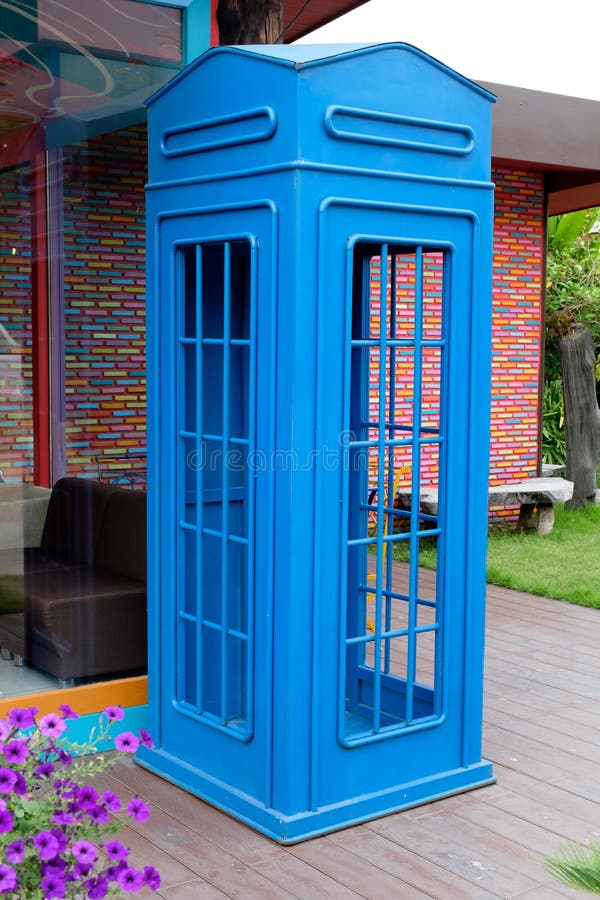 Blue telephone booth stock photo. Image of botanic, park - 83786080