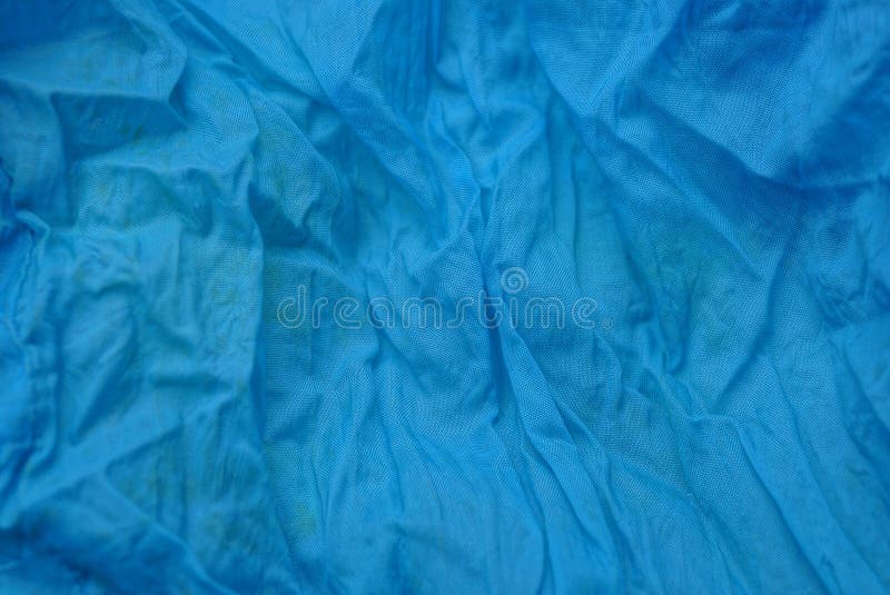 Blue Background of Crumpled Cloth from a Piece of Clothing Stock Image ...