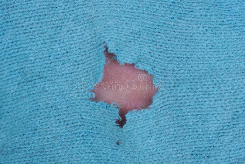 Blue Texture of Woolen Torn Fabric with a Brown Hole Stock Image ...