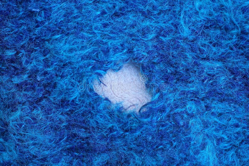 Blue Texture of Woolen Torn Fabric with a White Hole Stock Image ...