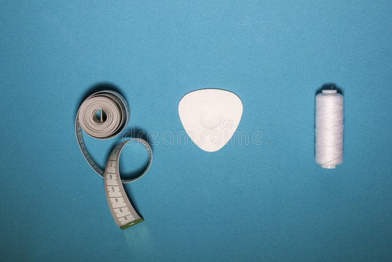 Sewing Accessories and Fabric on a Blue Background. Sewing Threads ...