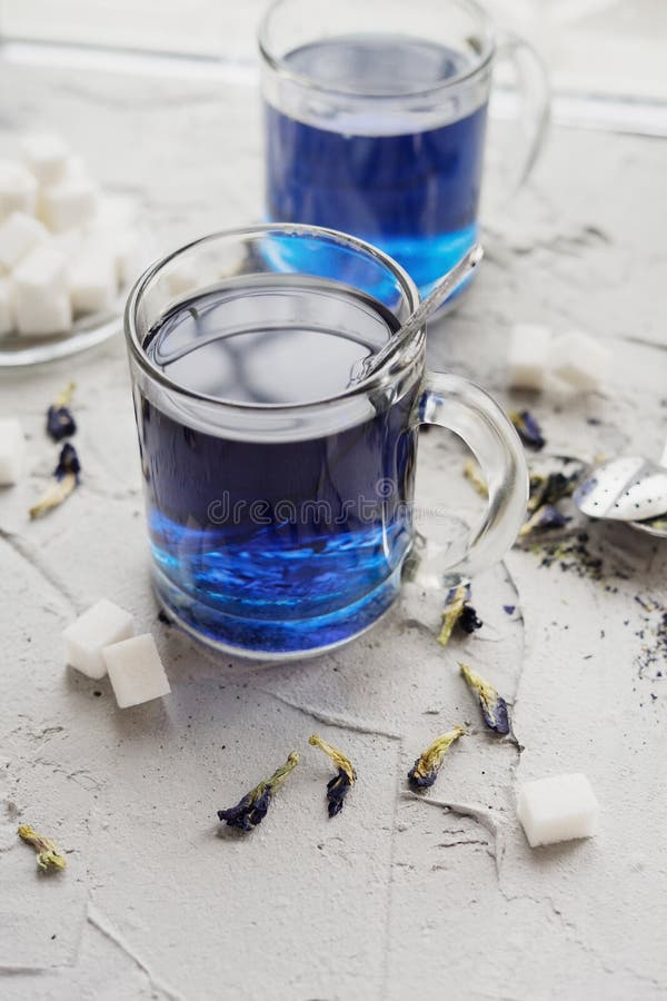 Thai Anchan Blue Tea is Poured from the Kettle into a Transparent Glass ...