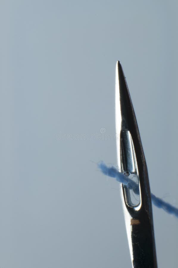 Blue Thread Led through Eye of a Sewing Machine Needle Stock Image ...