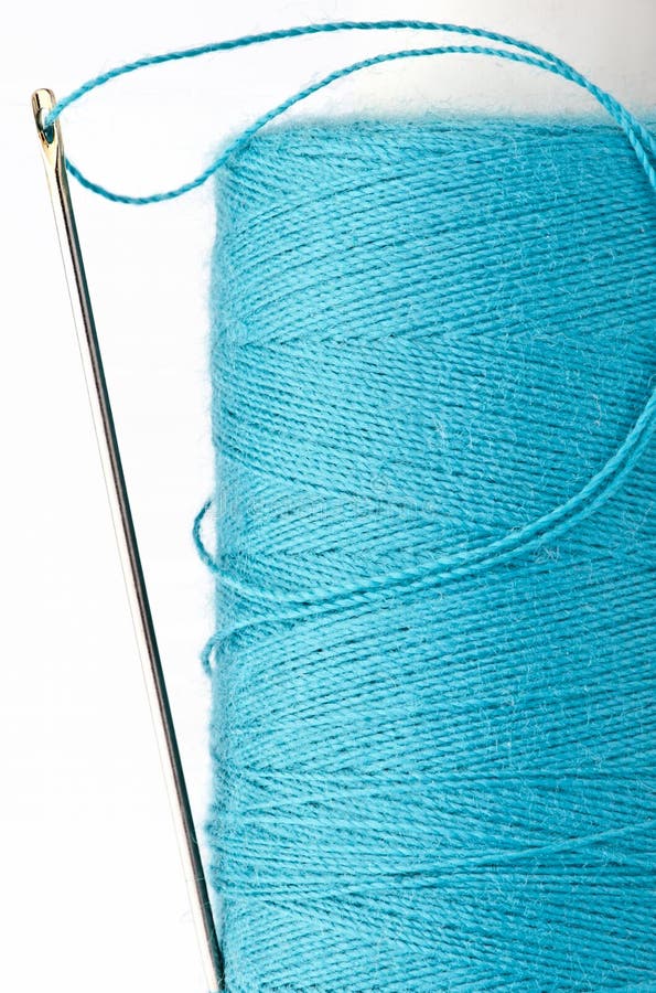 Blue thread with needle stock photo. Image of golden - 25348814