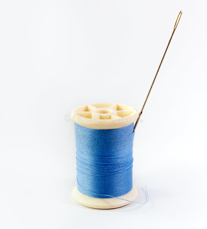 Spool of Blue Thread and Needle Stock Photo - Image of wooden, sewing ...