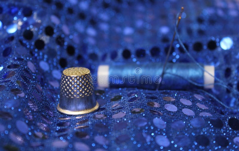 Blue Thread with Needle and Thimble on Blue Prom Dress Stock Image ...