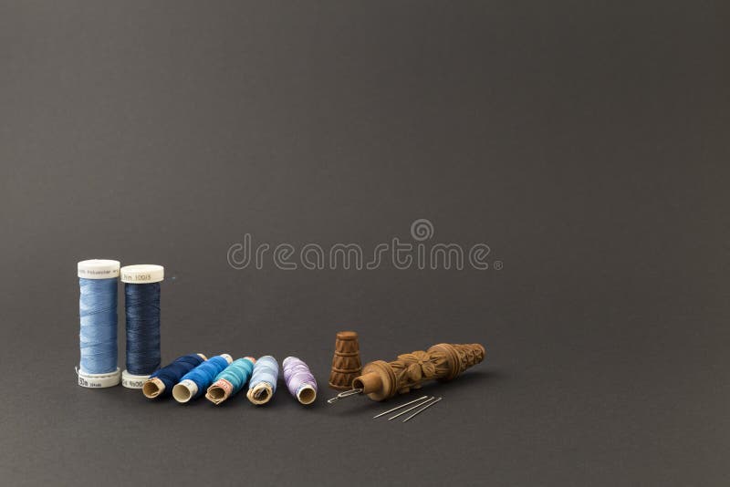 Blue Thread Spools with Needles Stock Image - Image of craft, ornate ...