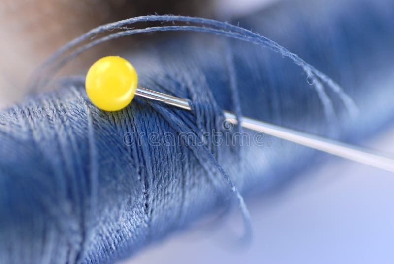 Blue thread and yellow pin stock image. Image of item - 3054507