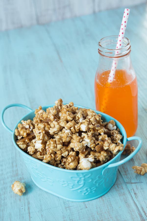 Blue Tin with Caramel Popcorn and Orange Soda Pop Snack Stock Photo ...