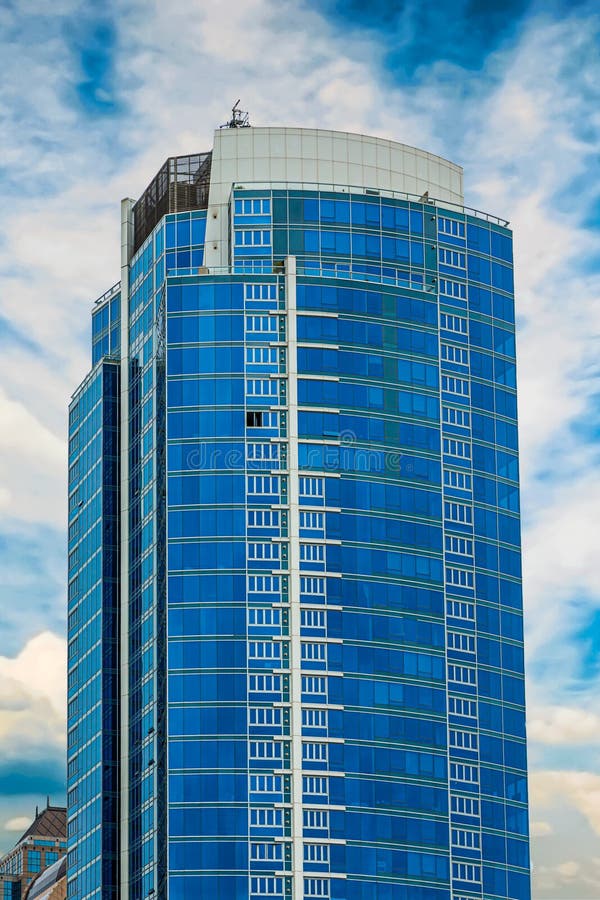 Blue Tower Beyond Green Trees Stock Photo - Image of corporate ...
