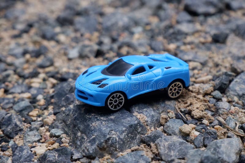 Blue Toy Car on Cobblestone Road Stock Photo - Image of fast, drive ...