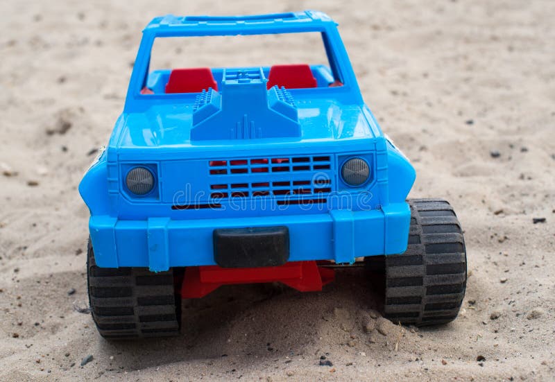 Blue toy car on the sand stock photo. Image of automobile - 52248588