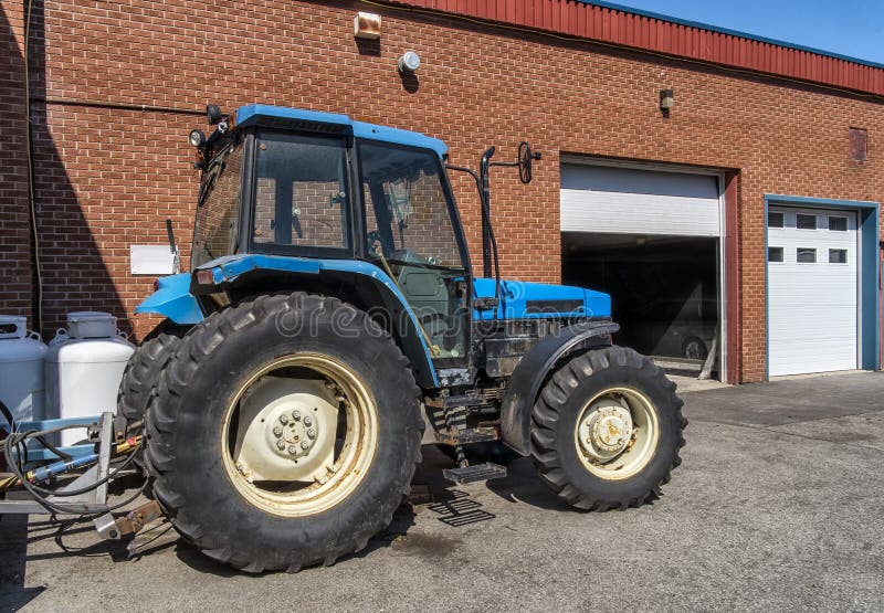 Blue tractor stock photo. Image of tires, equipment, front - 31211152