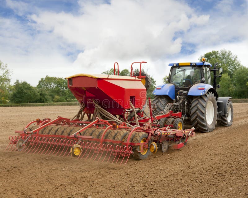 Blue Tractor Sowing Crops stock image. Image of equipment - 21325145