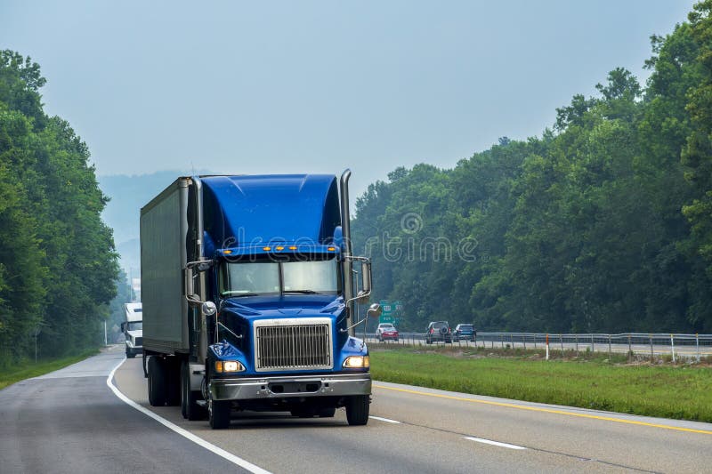 Blue Tractor-Trailer Rig Cruises an Interstate Highway Stock Image ...