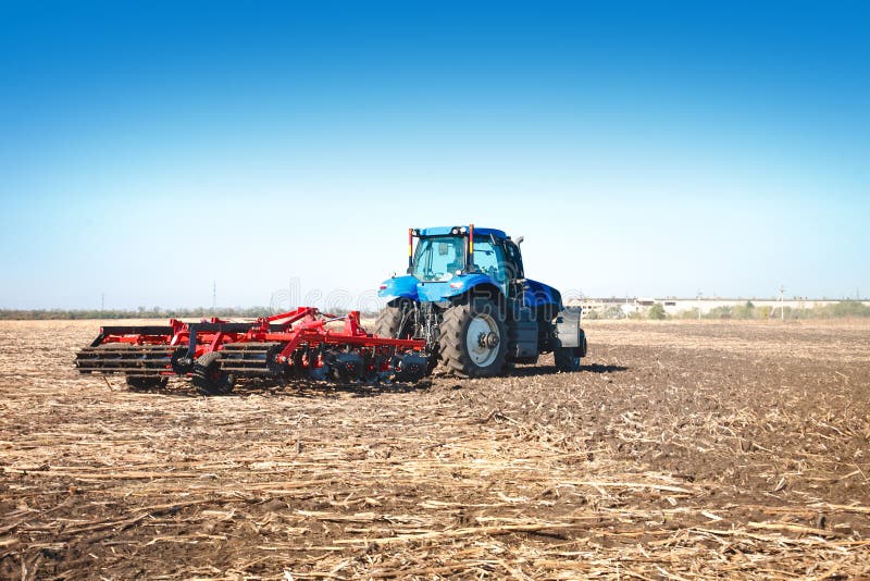 Blue Tractor Working in an Open Field Stock Image - Image of plow ...