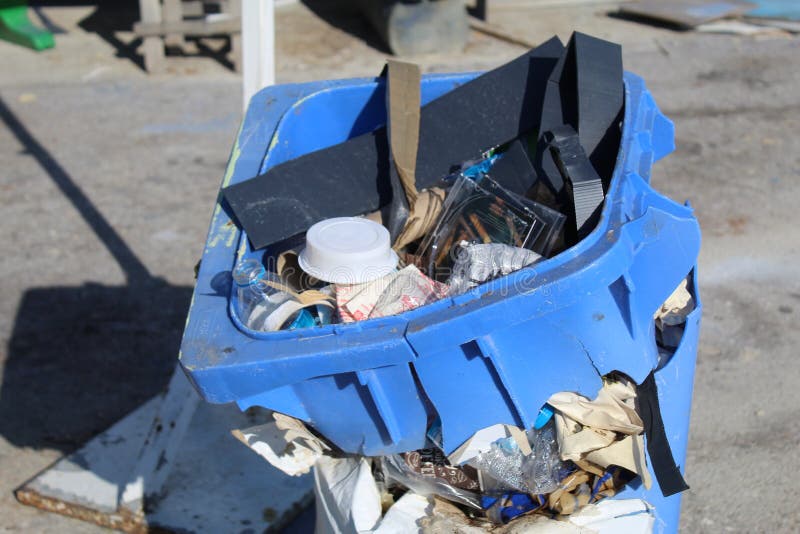 A Blue Trash Bin Full of Trash and Plastic for Recycle Stock Image ...