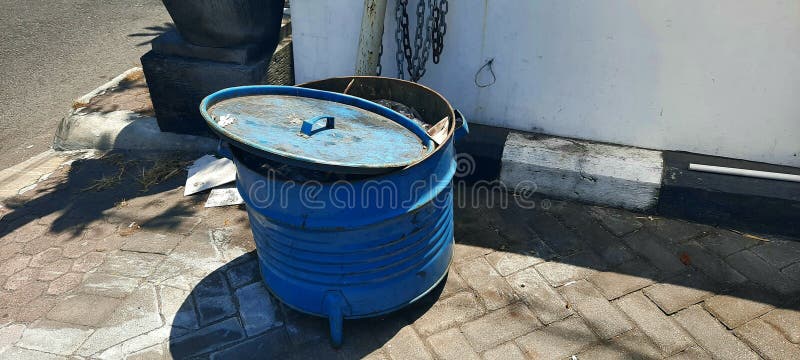 Blue Trash Can with a Half-open Lid Located in the Yard Stock Image ...