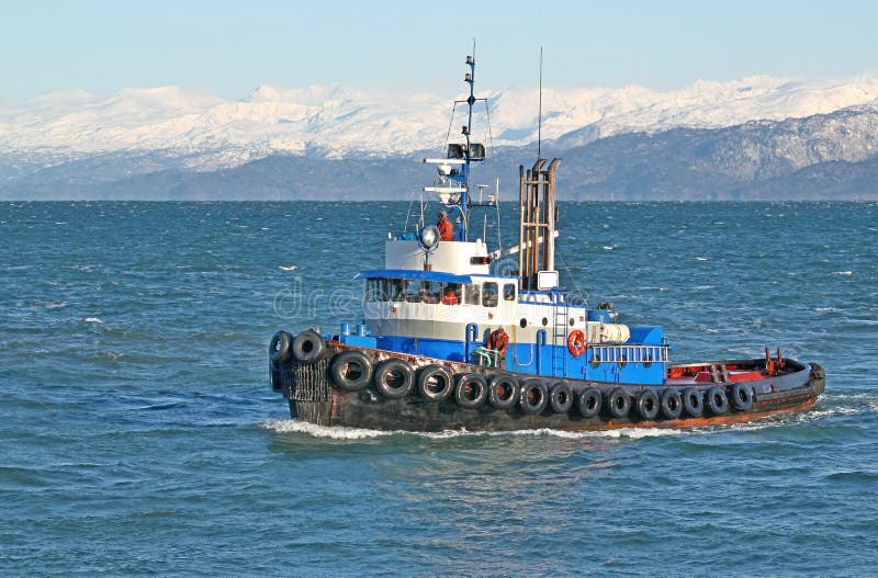 Blue tugboat in the bay stock image. Image of nautical - 22123269