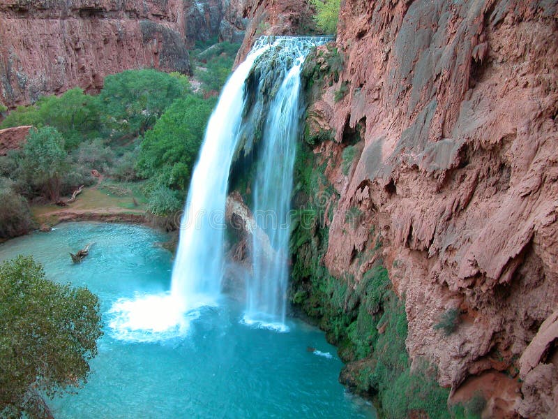 Blue Turquoise Waterfall On Red Travertine Stock Images - Image: 143744