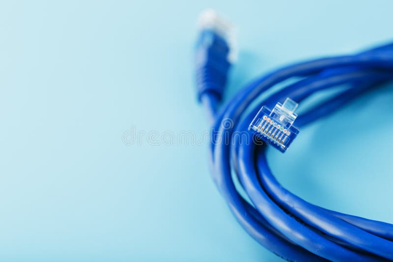 A Coil of an Internet Network Cable for Data Transmission on a Blue ...