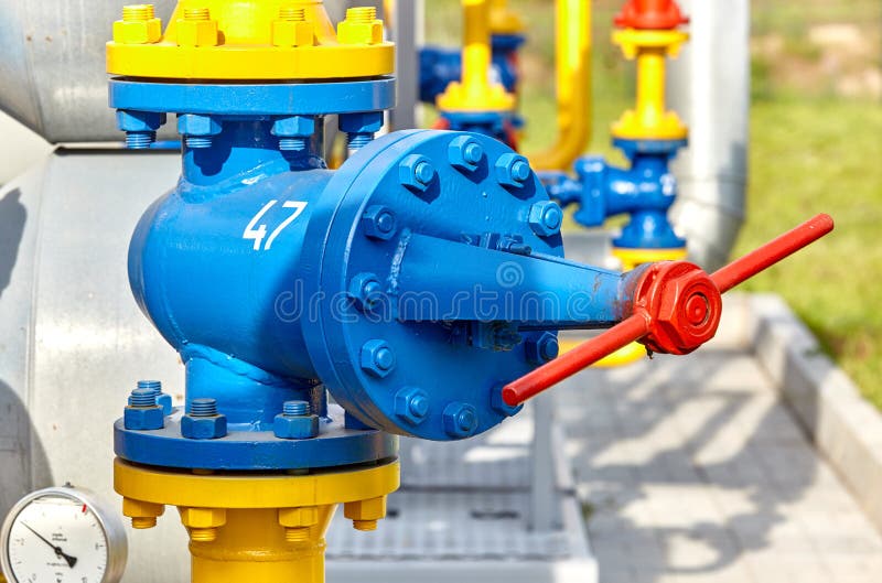 Blue Valve on a Yellow Pipe at a Gas Processing Plant Stock Photo ...
