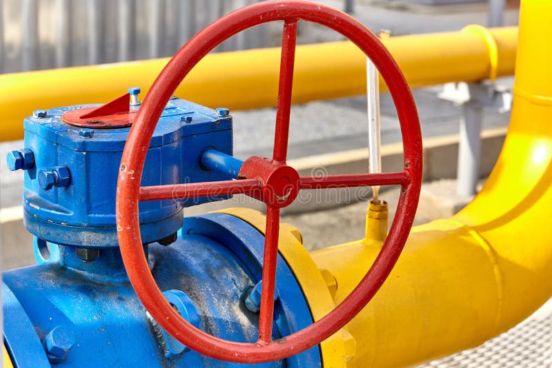 Blue Valve on a Yellow Pipe at a Gas Processing Plant Stock Photo ...
