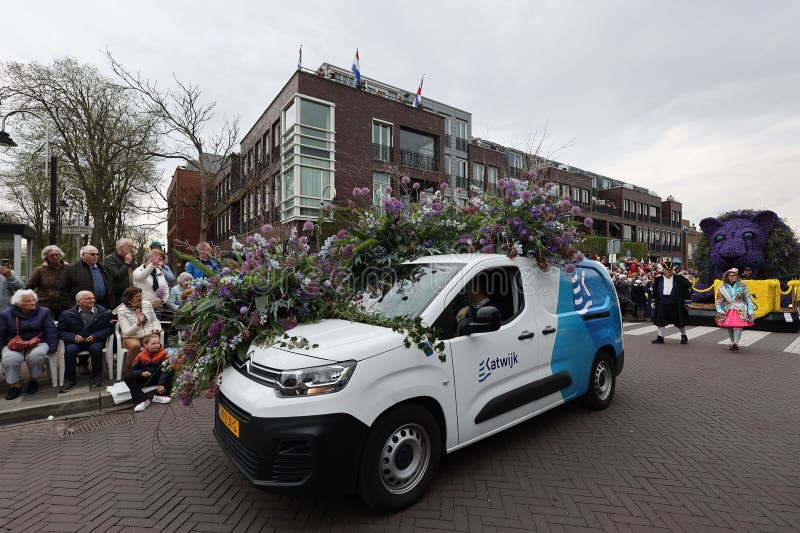 Blue Van Adorned with Colorful Flower Decorations at the Flower Parade ...