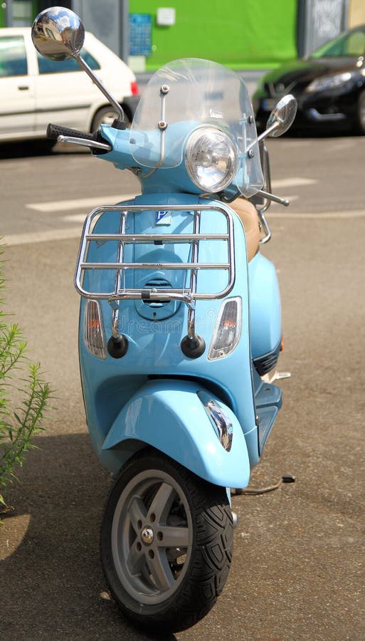 Blue Vespa scooter editorial stock photo. Image of suburb - 101969828