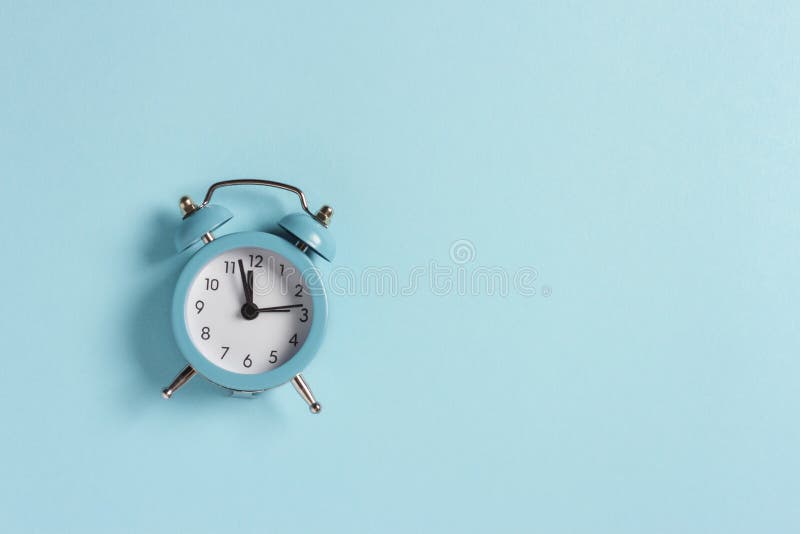 Blue Vintage Clock on Blue Background Stock Image - Image of waking ...