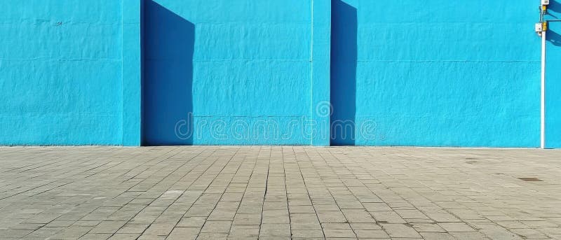 Blue Wall Creates a Modern Geometric Pattern on Exterior and Pathway ...