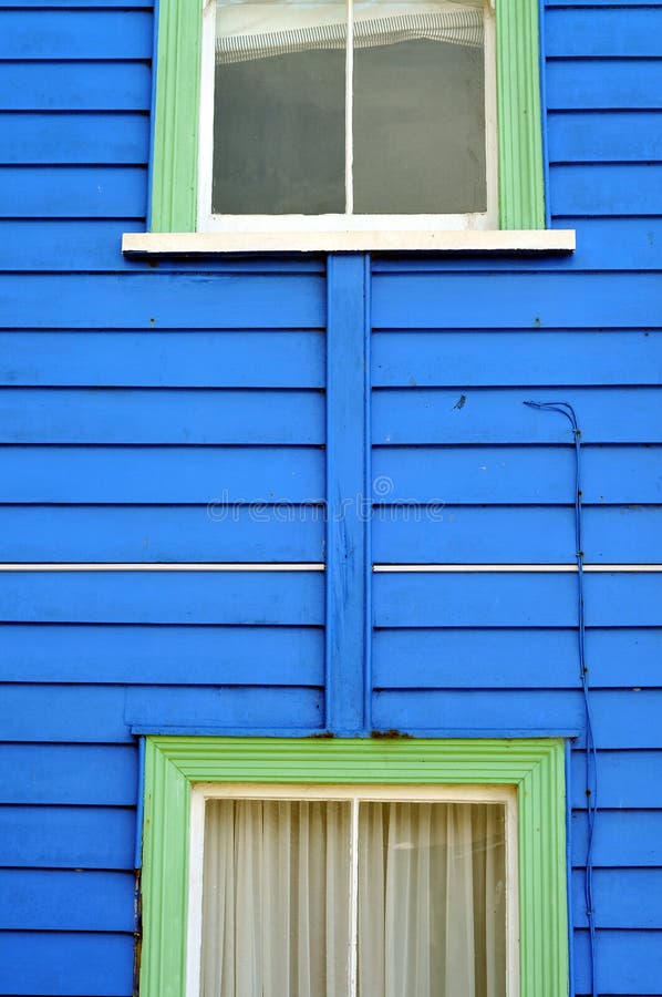 Blue Wall With Green Windows Stock Photo - Image of windows, glass ...