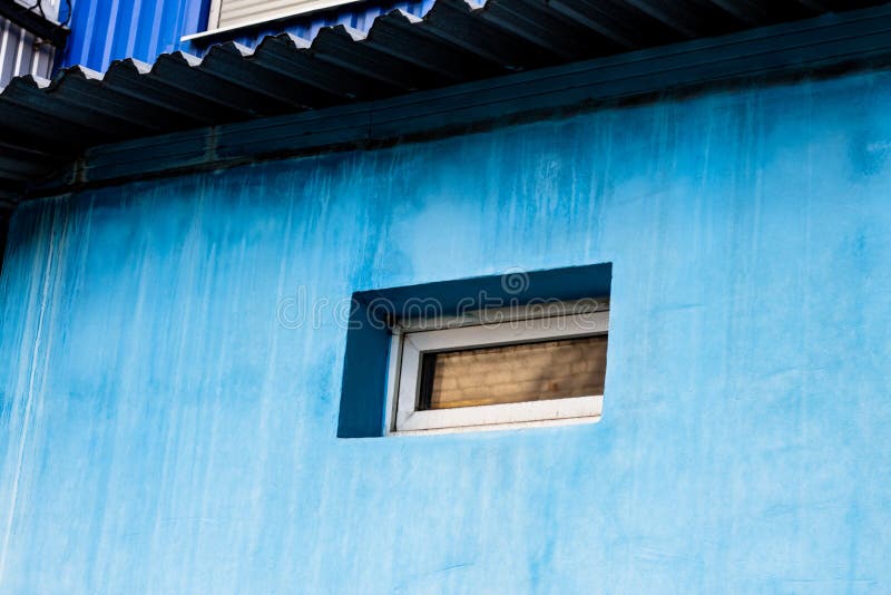 Blue Wall of the House with a Closed Window Left and Details. Stock ...