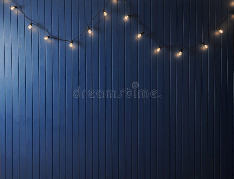 Blue Wall with Retro Garland of Light Bulbs. Texture for the Design ...