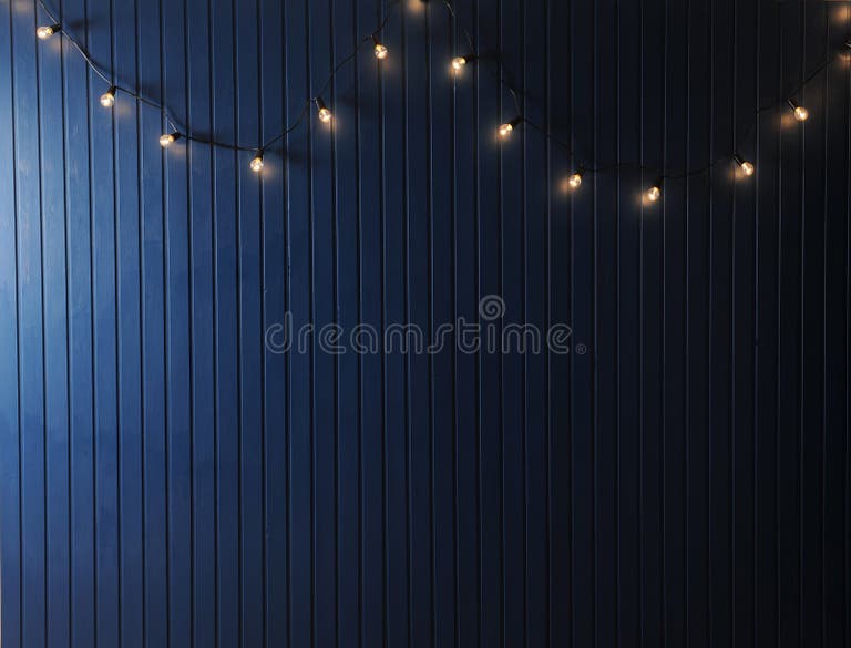 Blue Wall with Retro Garland of Light Bulbs. Texture for the Design ...